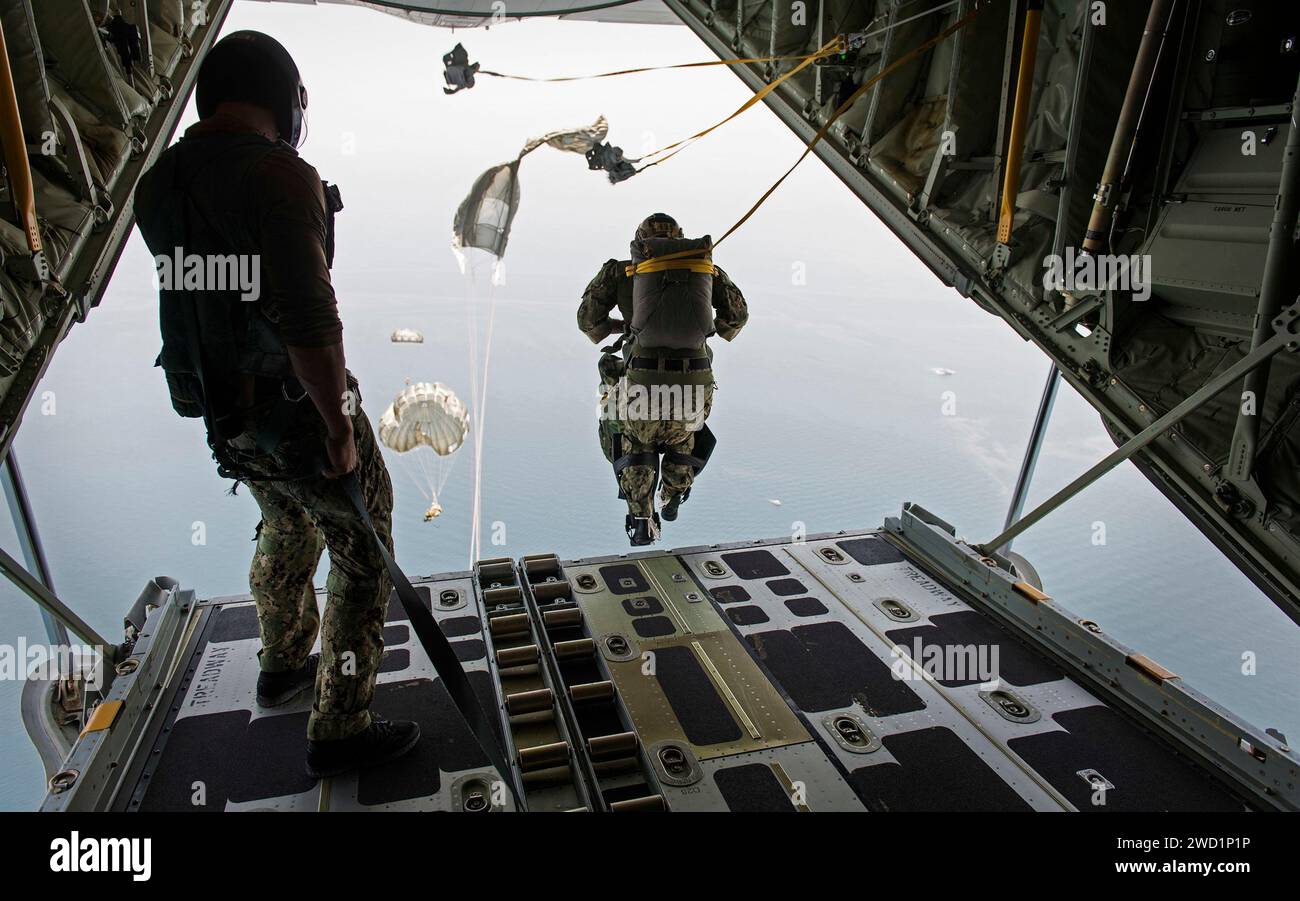 Explosive Ordnance Disposal Technicians conduct a static line jump in ...