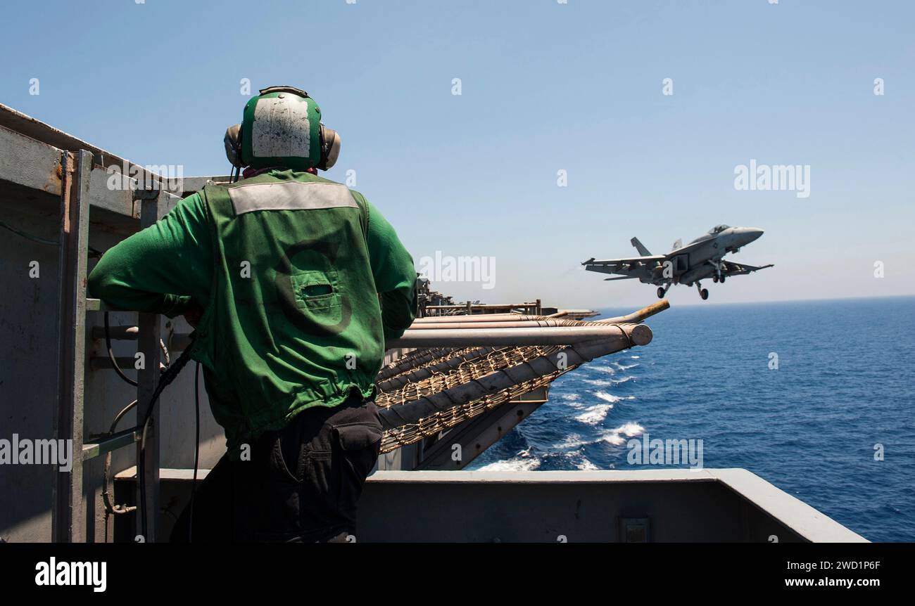 Aviation Boatswain's Mate observes flight operations aboard USS George ...