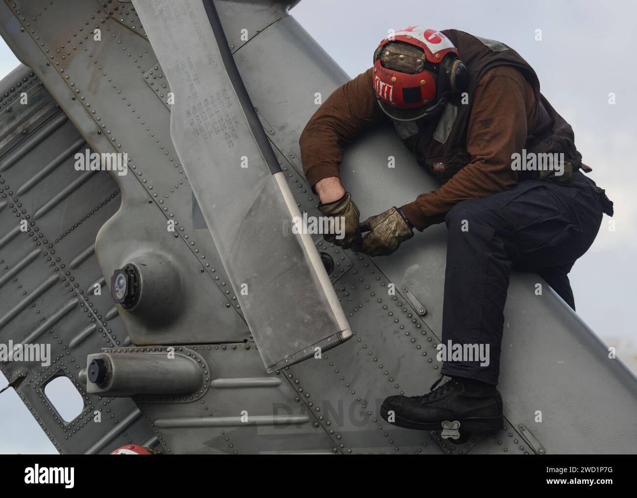 Aviation Structural Mechanic conducts post-flight maintenance on the ...