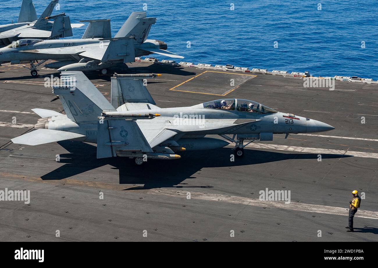 An F/A-18F Super Hornet takes off from the Nimitz-class aircraft ...