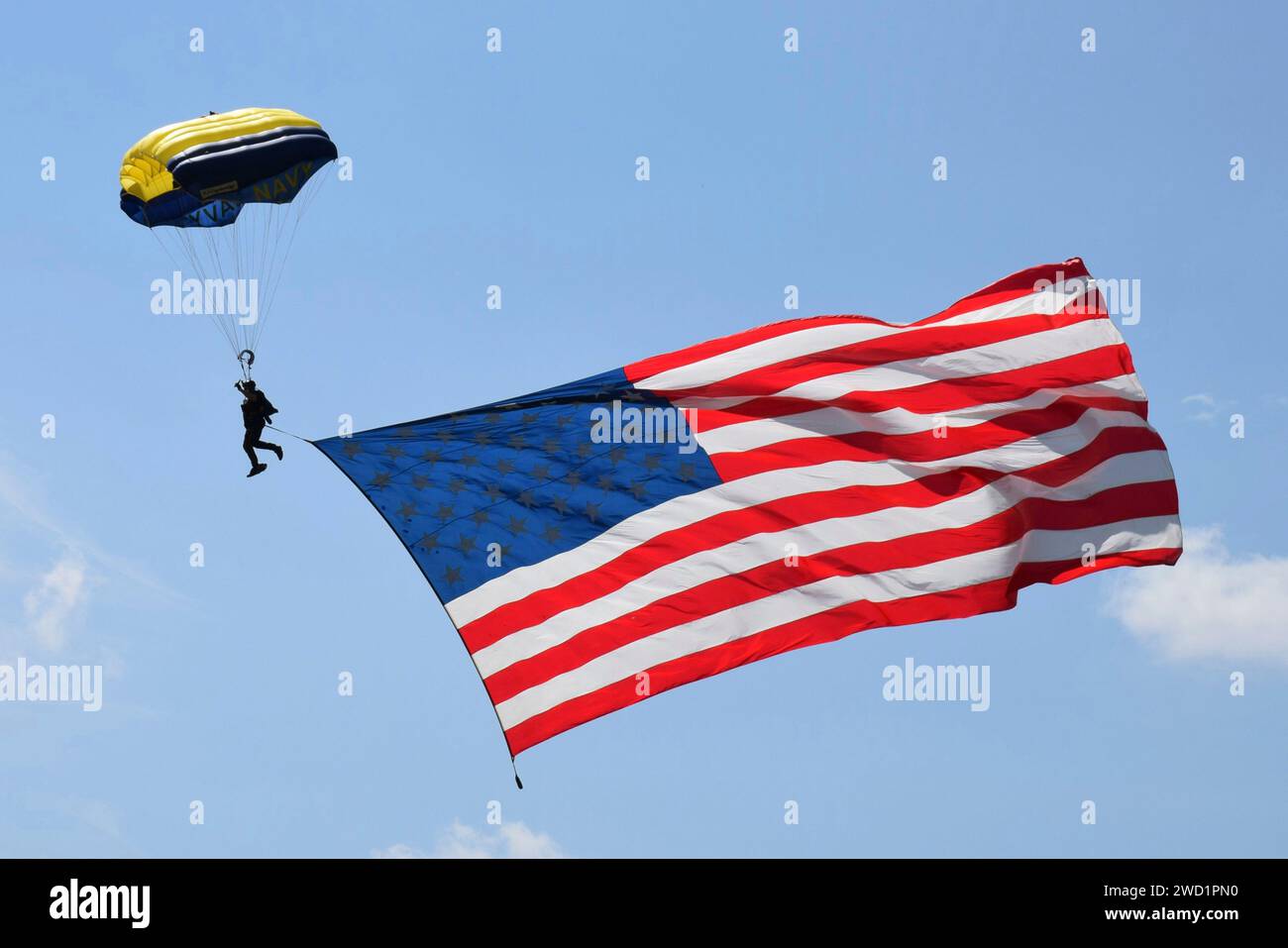 The U.S. Navy parachute demonstration team, the Leap Frogs, flying an ...