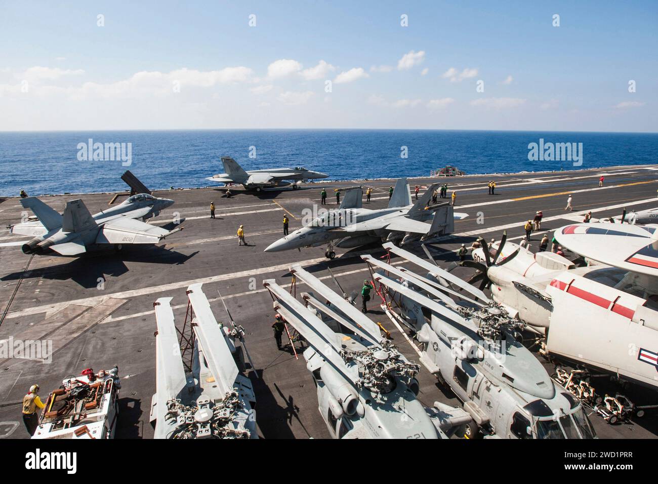 Aircraft taxi on the flight deck in preparation for launch aboard USS ...