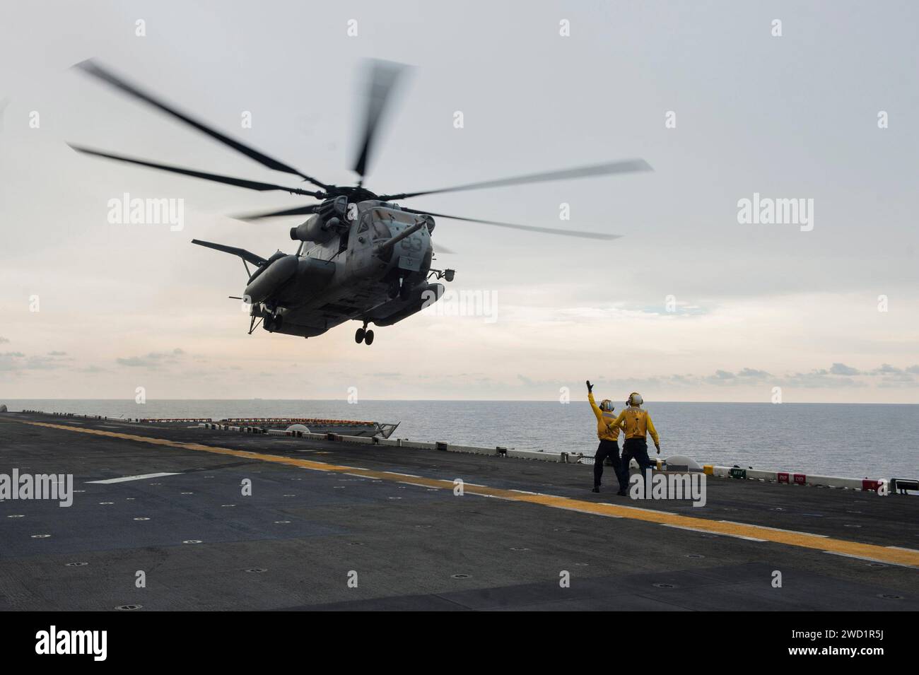 A CH-53E Super Stallion helicopter takes off from the flight deck of ...