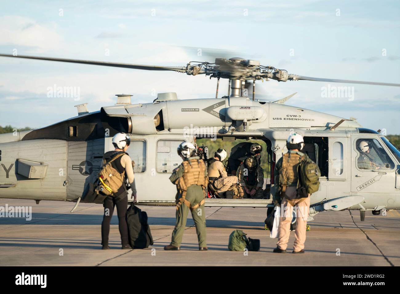 Sailors return in an MH-60S Sea Hawk helicopter after a search and ...