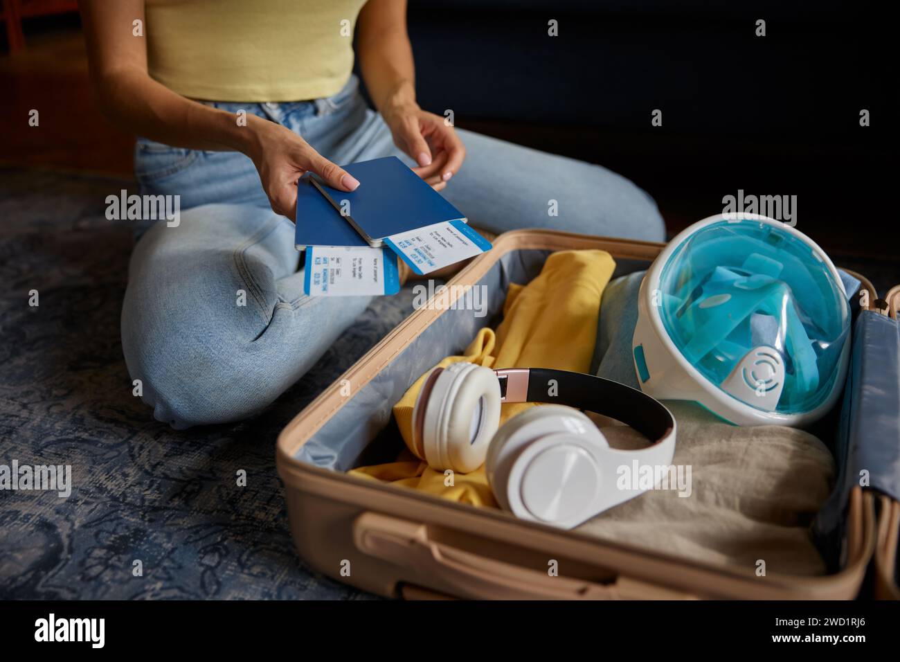Closeup woman holding travel ticket with boarding pass and passport ...