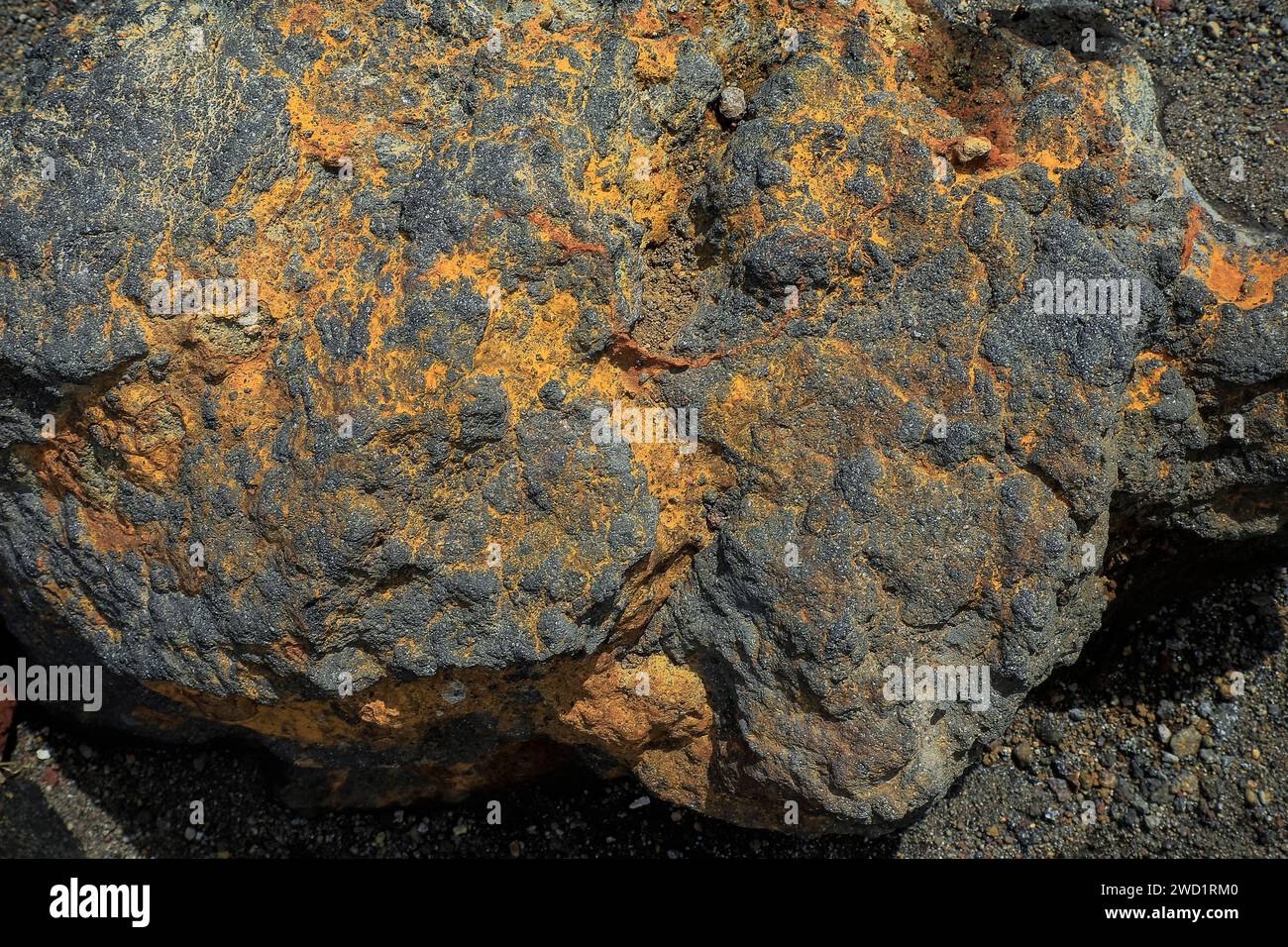 Sulphur deposits in a piece of lava rock on the flank of active Mount ...