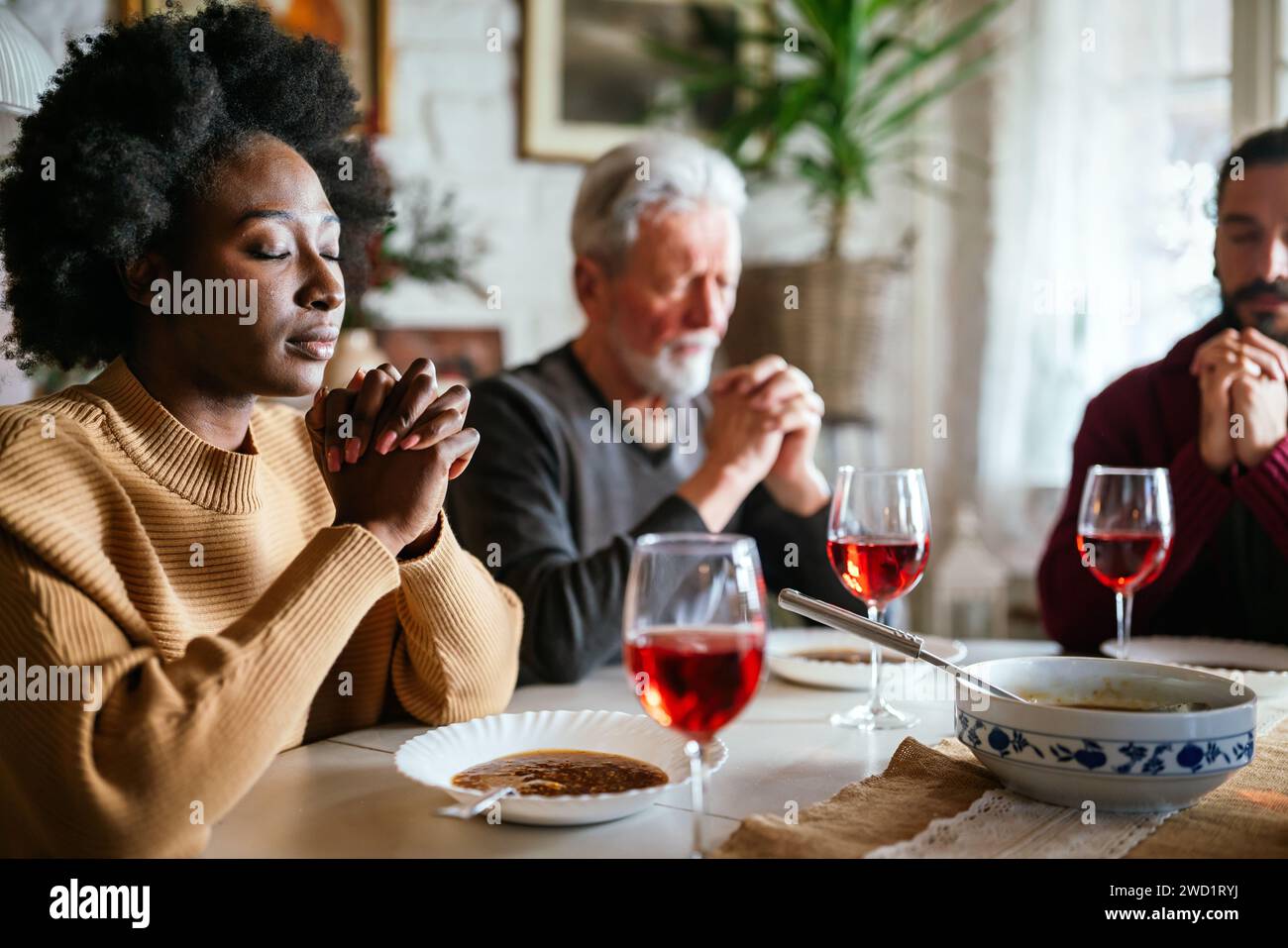 Family and religious concept. Group of multiethnic people with food ...