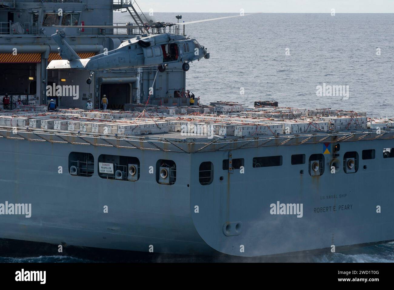 Seaman participates in line handling on the flight deck of USNS Robert ...