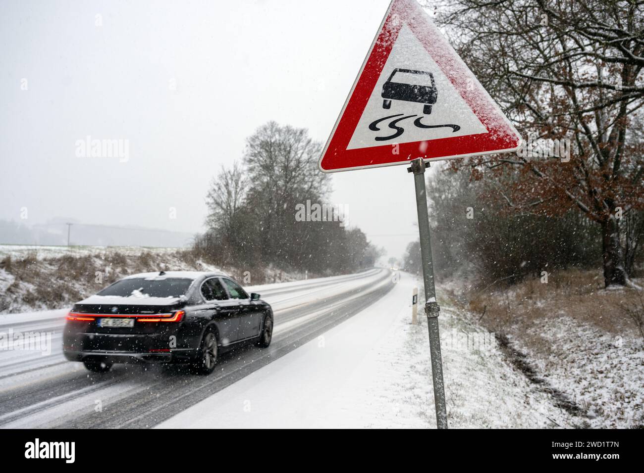Kaltenbrunn, Germany. 18th Jan, 2024. A car is driving on a snow ...