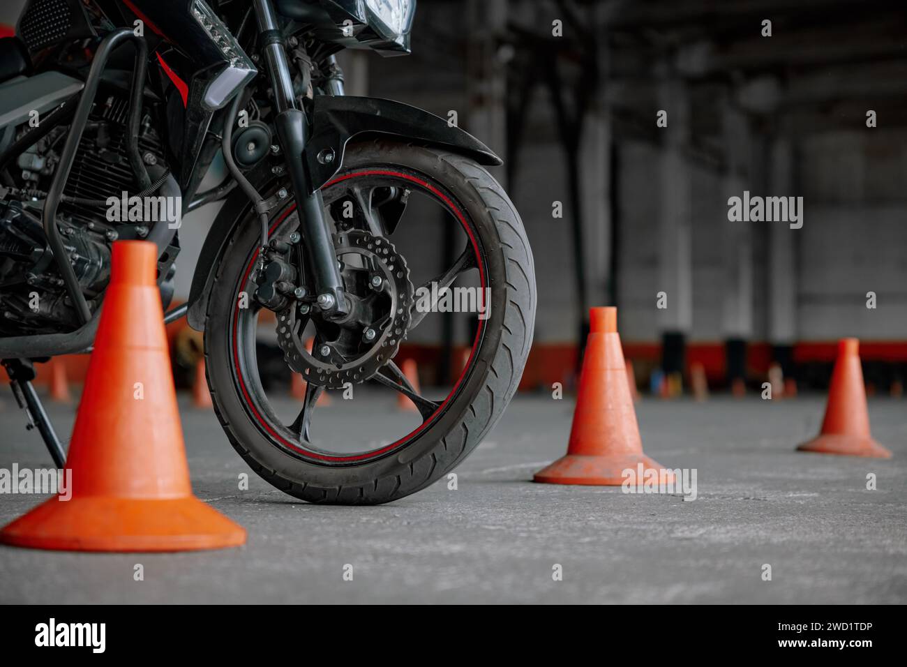 Closeup view on wheel of training motorcycle at driving school ...