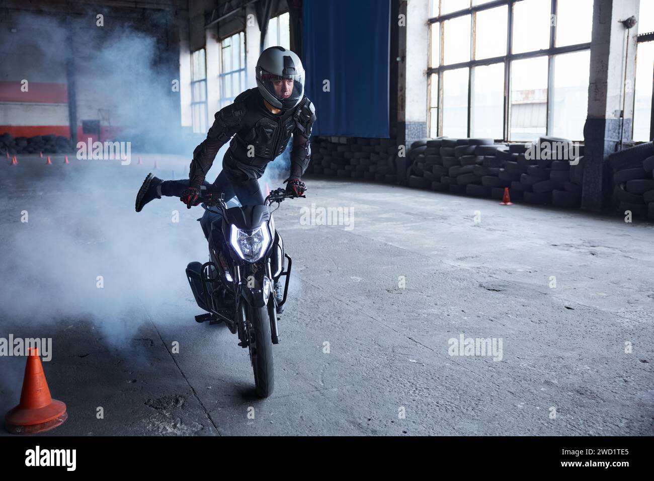 Motor rider making difficult and dangerous stunt on his motorbike Stock ...