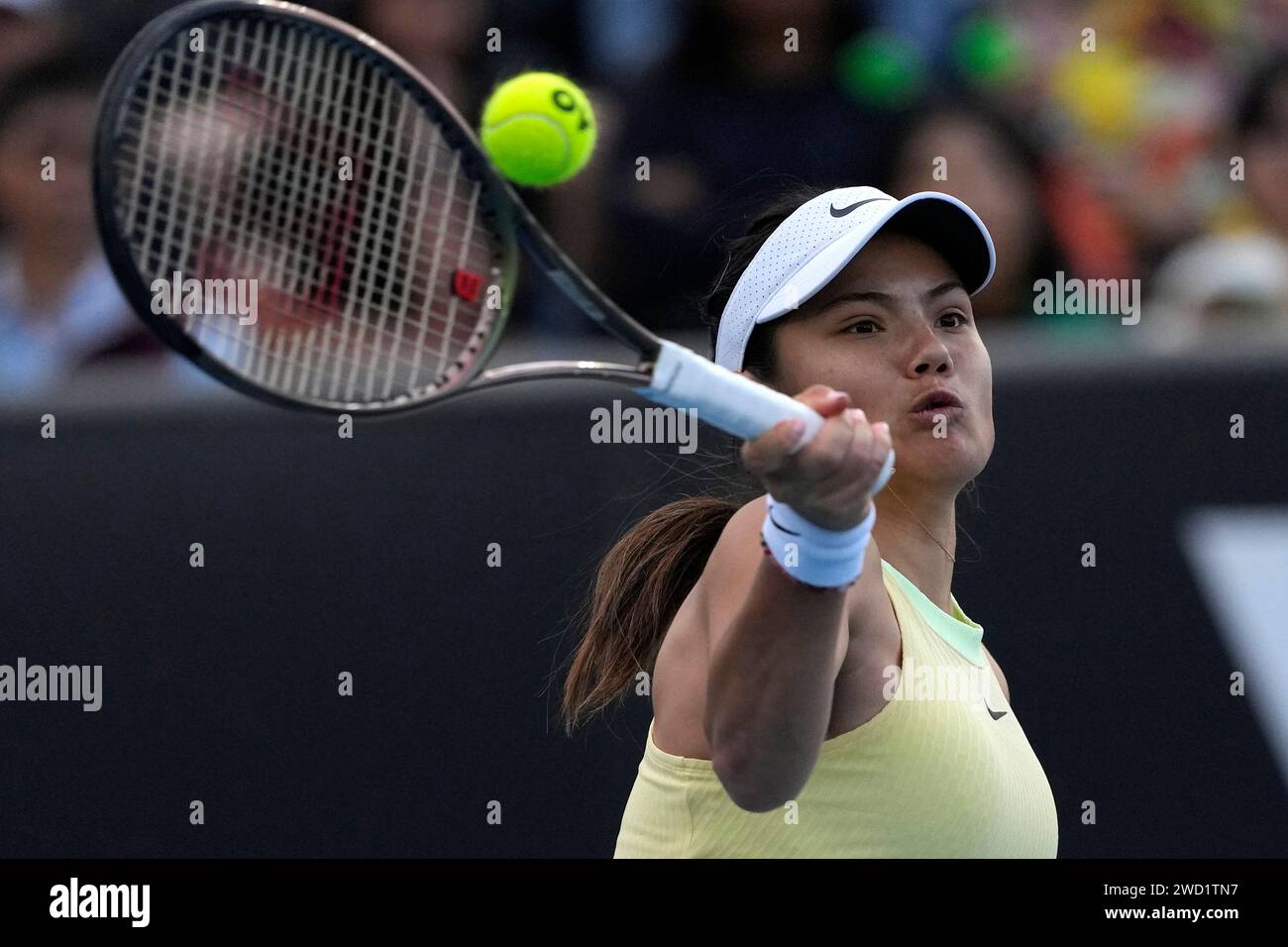 Emma Raducanu of Britain plays a forehand return to Wang Yafan of China ...
