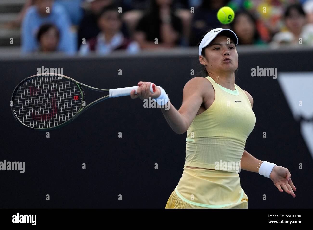 Emma Raducanu of Britain plays a forehand return to Wang Yafan of China ...