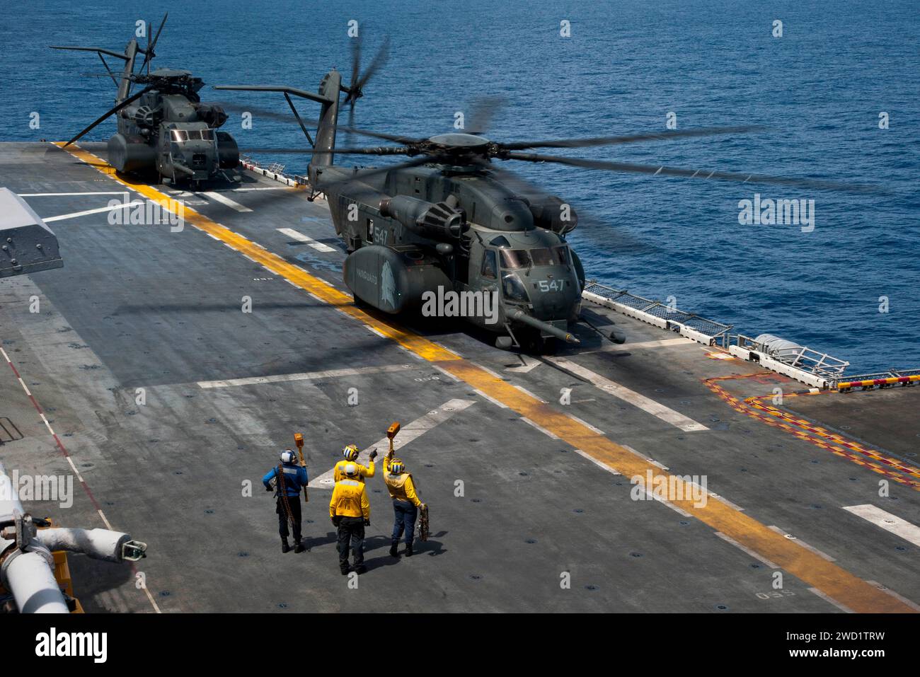 An MH-53E Sea Dragon helicopter prepares to take off from the flight ...