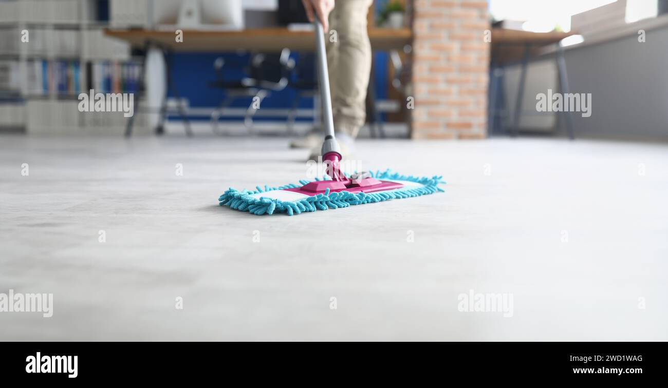 Person wiping floor with fluffy mop, domestic work, housewife cleaning ...