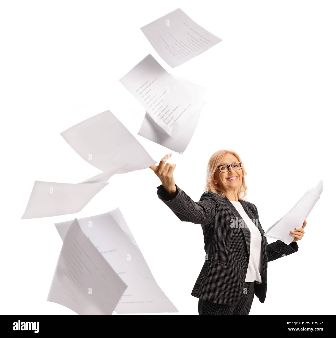 Happy middle aged woman throwing paper documents and smiling isolated ...