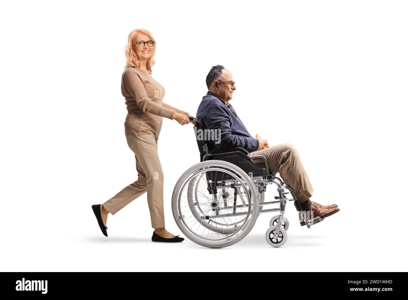 Woman pushing a man in a wheelchair isolated on white background Stock ...