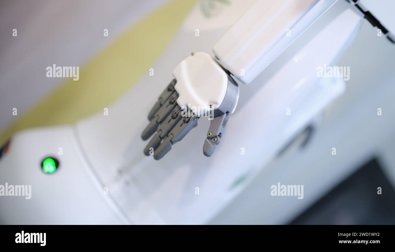 White automated arm of computer robot in production Stock Photo - Alamy