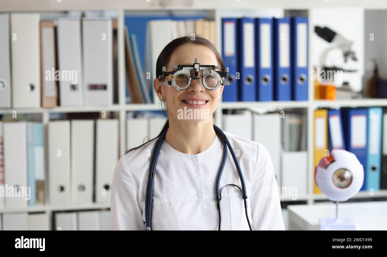 Ophthalmologist wear optometrist trial frame at ophthalmology office, select glasses for better ...