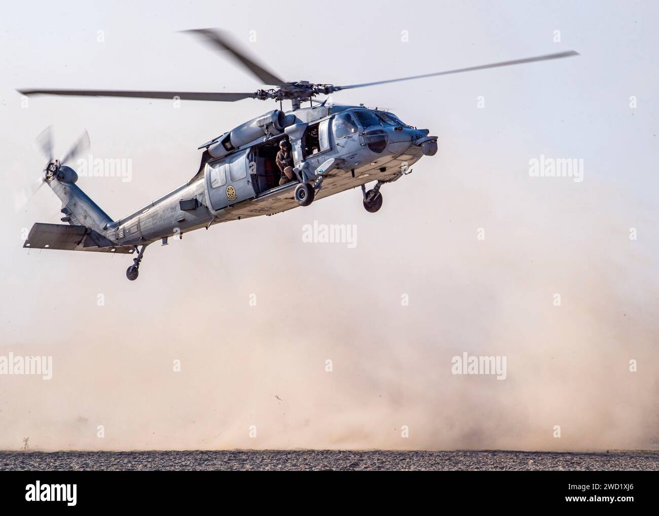 An MH-60S Knighthawk helicopter practices Terrain Flight tactical ...