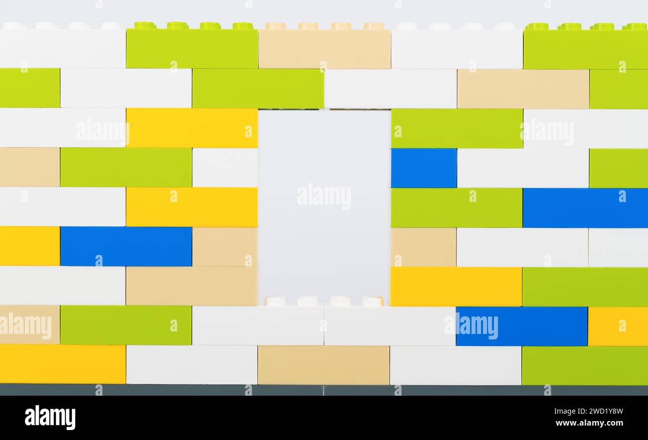 Colorful plastic bricks wall on white background Stock Photo - Alamy