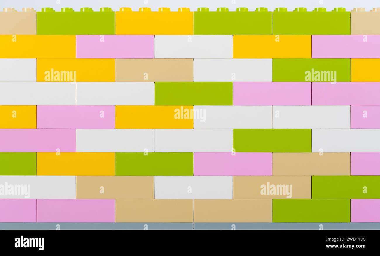 Colorful plastic bricks wall on white background Stock Photo - Alamy