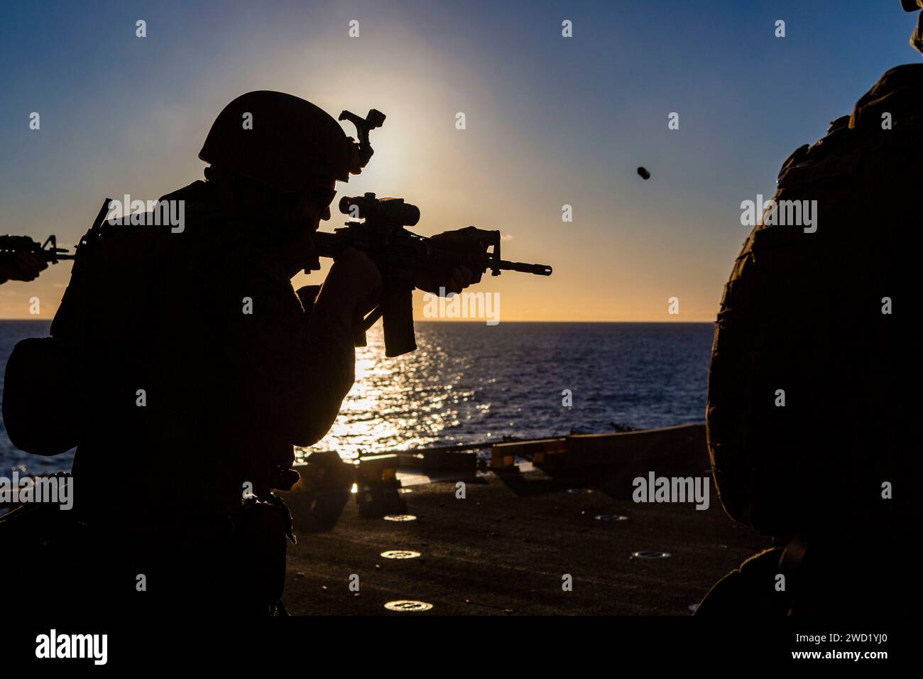 A U.S. Marine fires an M4 carbine during a combat marksmanship exercise ...