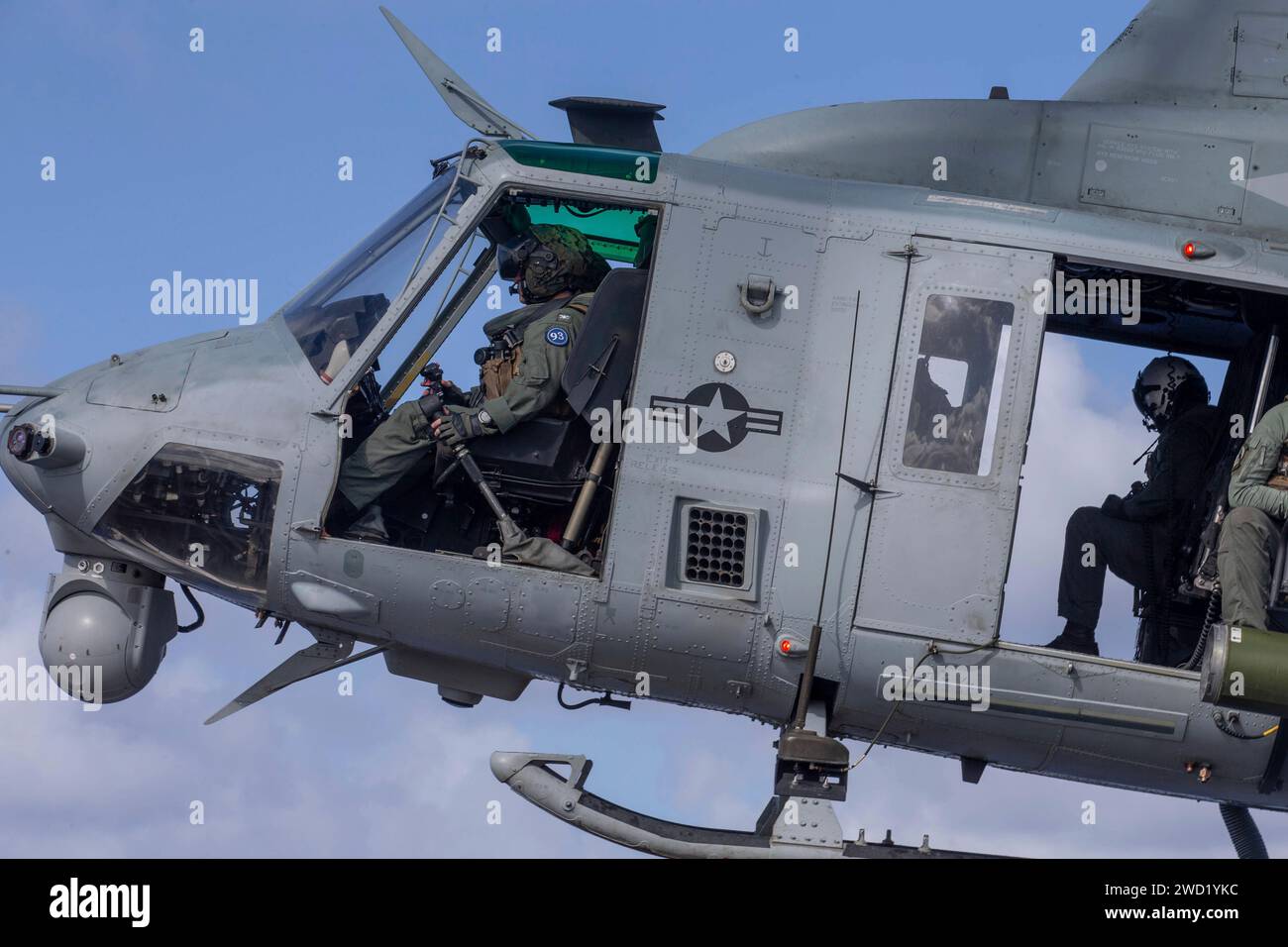 A UH-1Y Venom conducting a routine flight over the Pacific Ocean Stock ...