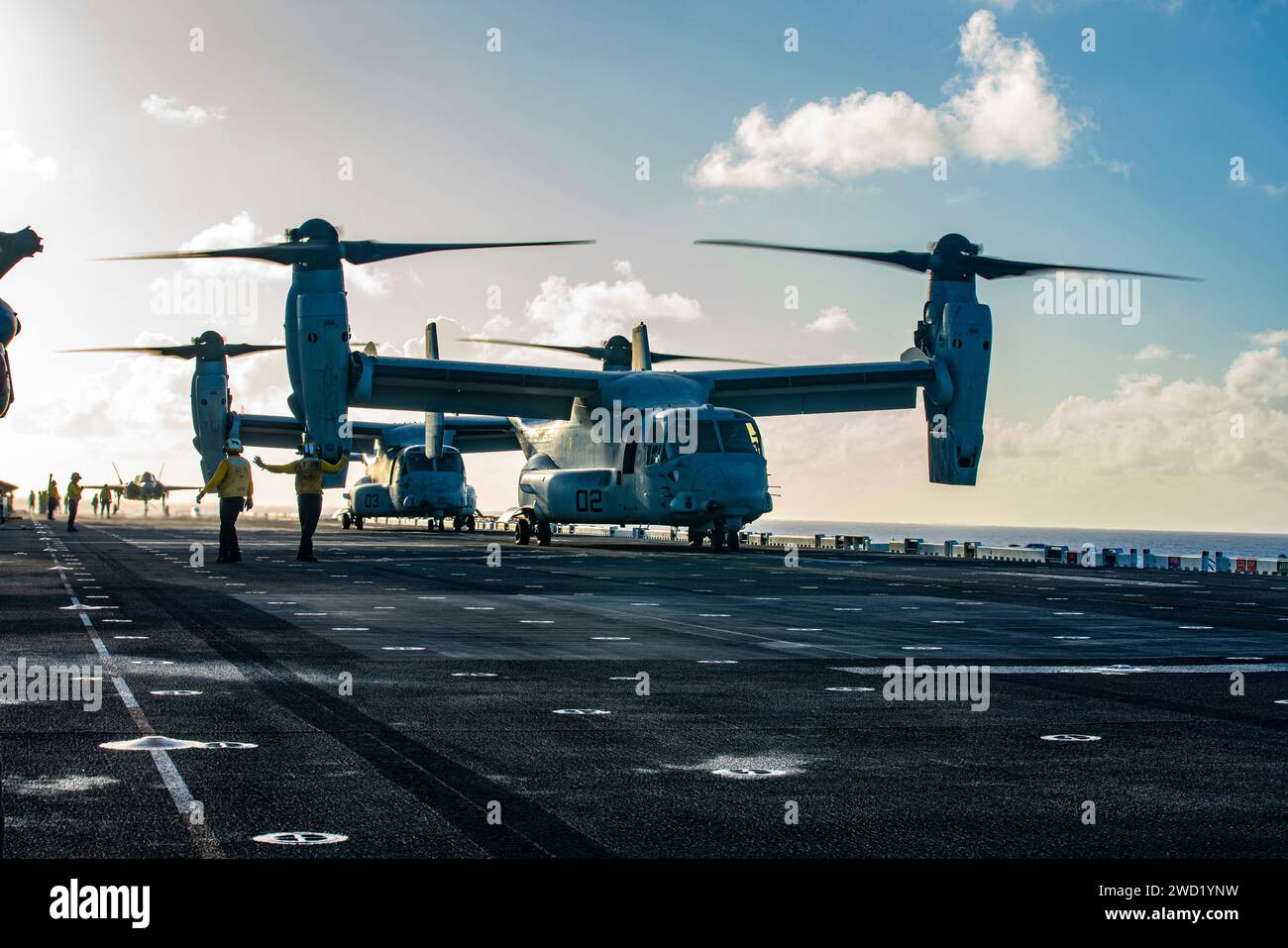 U.S. Marine Corps MV-22 Ospreys prepare to take off from the flight ...