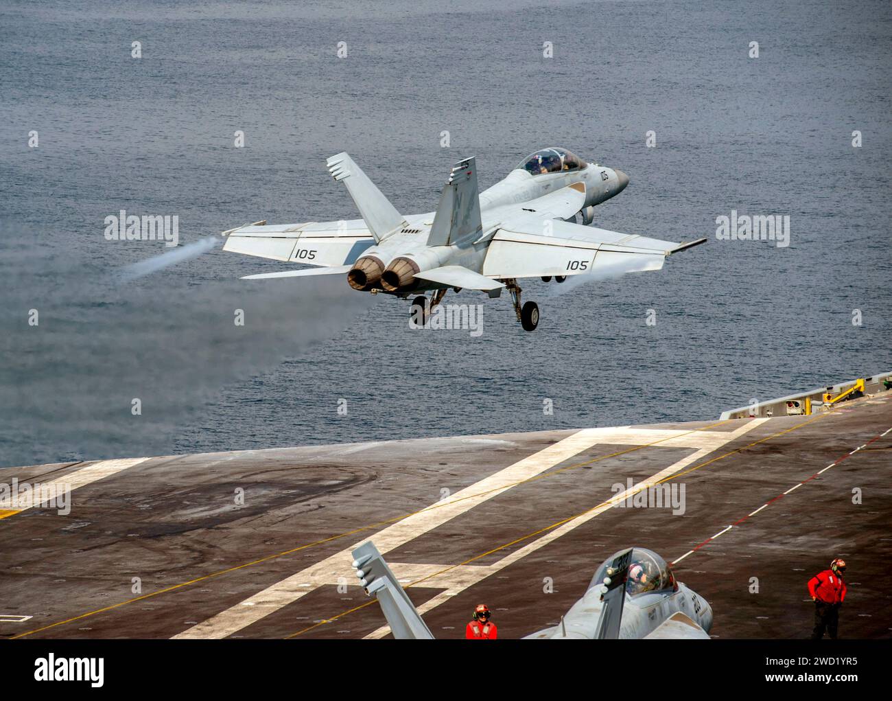 An F/A-18F Super Hornet launches off the flight deck of the aircraft carrier USS Nimitz Stock ...