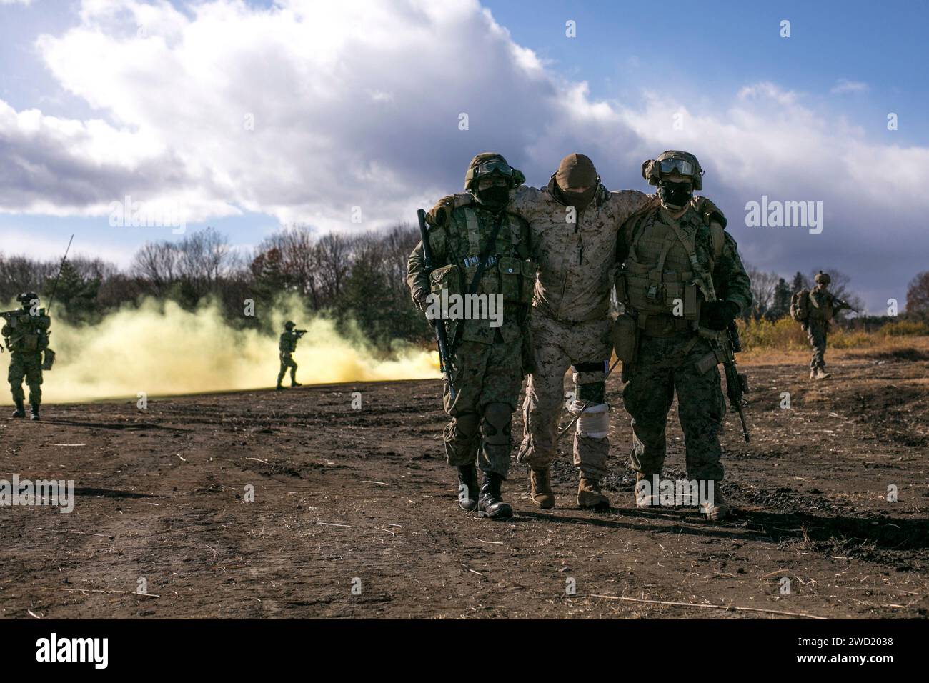 A corpsman evacuates the casualty during a tactical recovery of ...