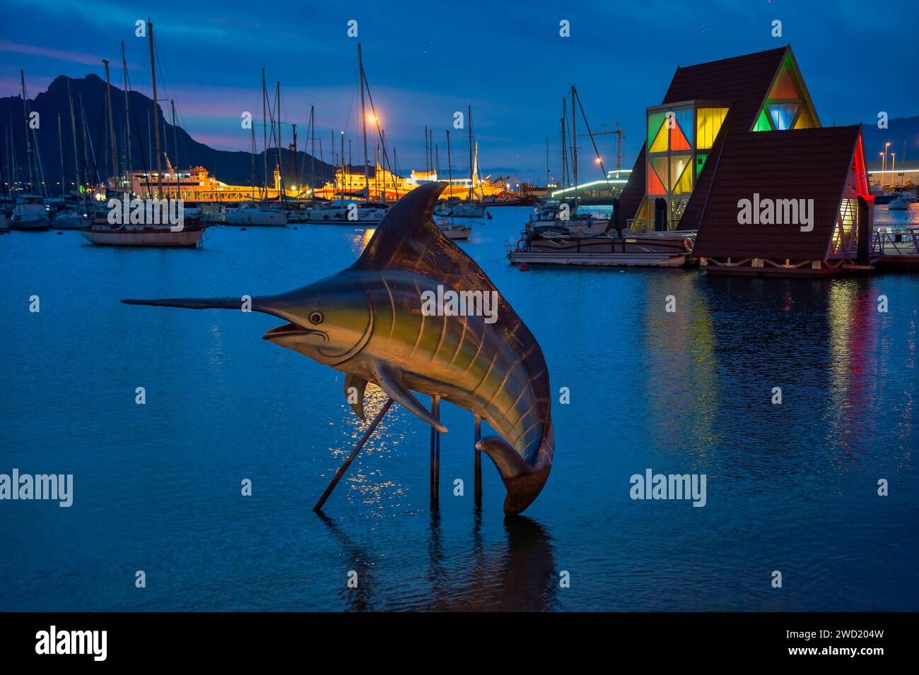 Twilight view of a marina in Mindelo, Cape Verde, featuring a metallic ...