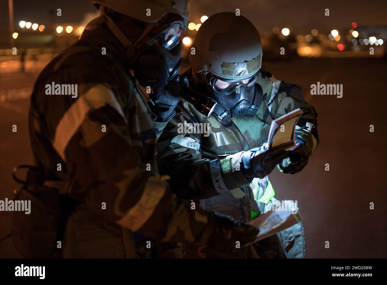 Senior Airmen perform a post attack reconnaissance sweep at Offutt Air ...