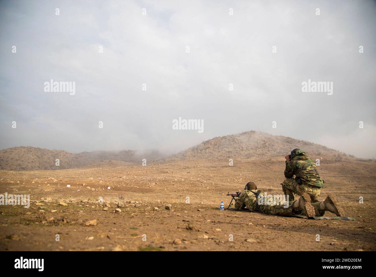 Hungarian soldiers demonstrate how to fire a PKM machine gun during ...