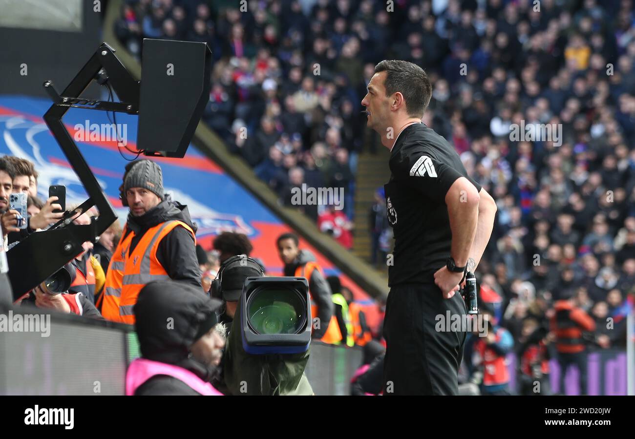 Referee, Andy Madley looks at the VAR Video Assistant Referee monitor ...