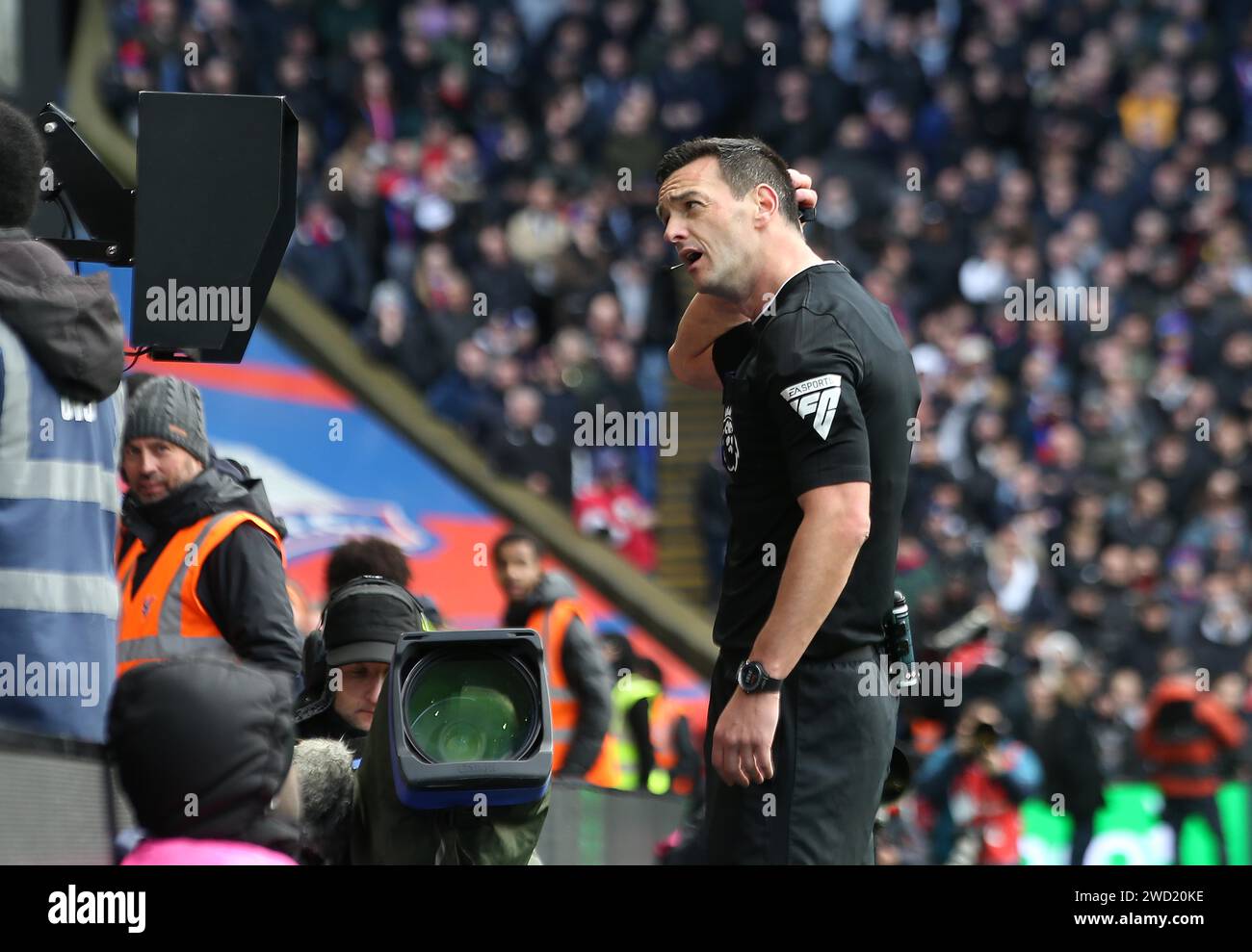 Referee, Andy Madley looks at the VAR Video Assistant Referee monitor ...