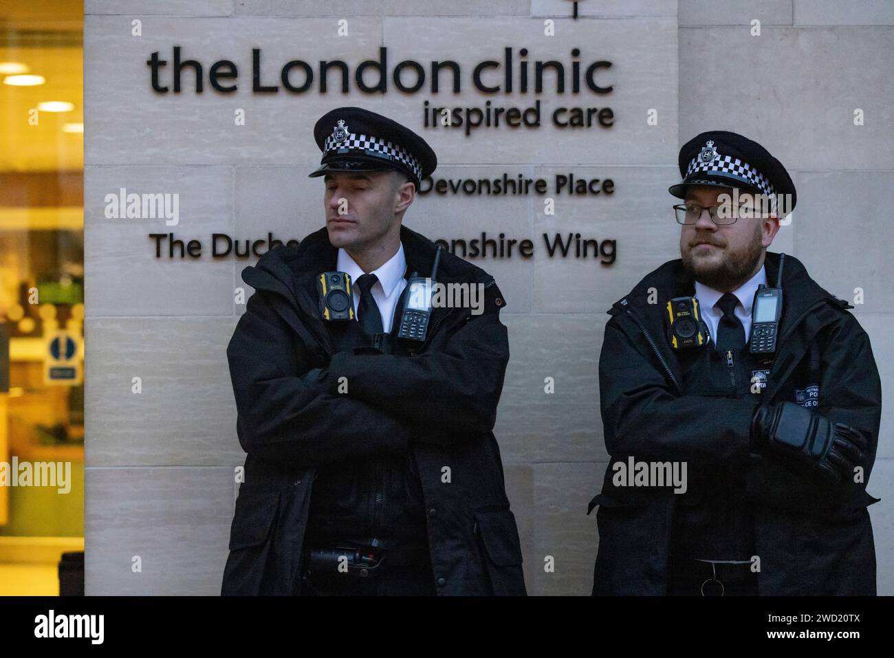 Police officers stand outside the London Clinic at Devonshire Place in ...