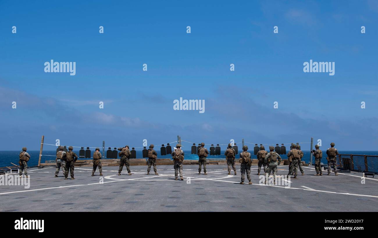 U.S. Marines participate in a small arms gun shoot qualification on the ...