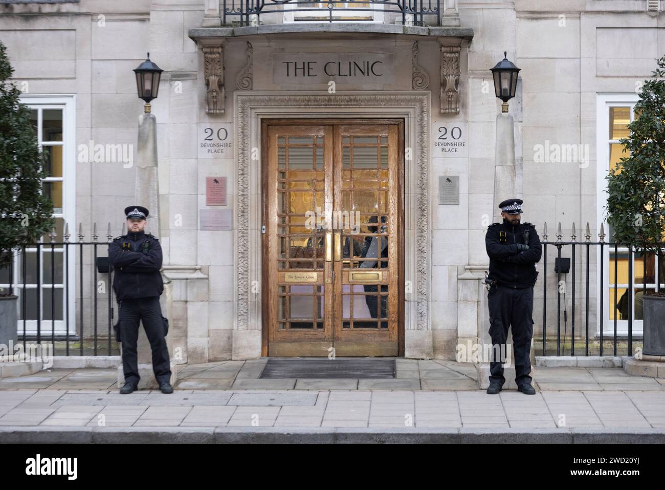 Police officers stand outside the London Clinic at Devonshire Place in ...