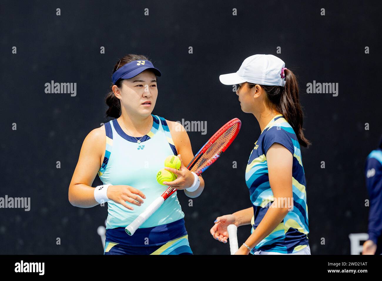 Melbourne, Australia. 18th Jan, 2024. Zhu Lin (L) communicates with Wu ...