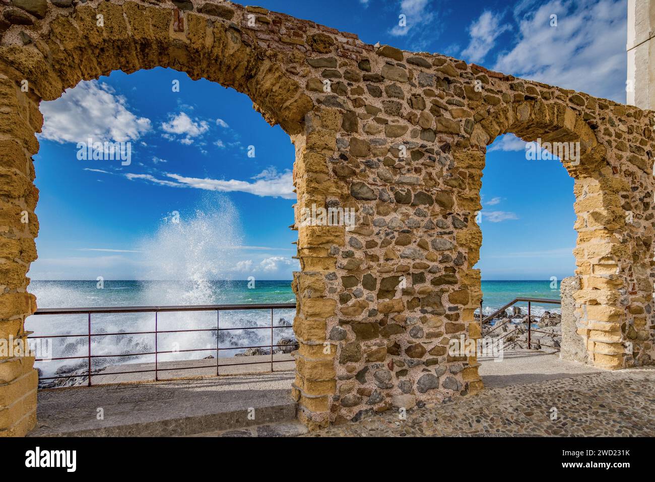 The waves crash against the rocks hi-res stock photography and images ...