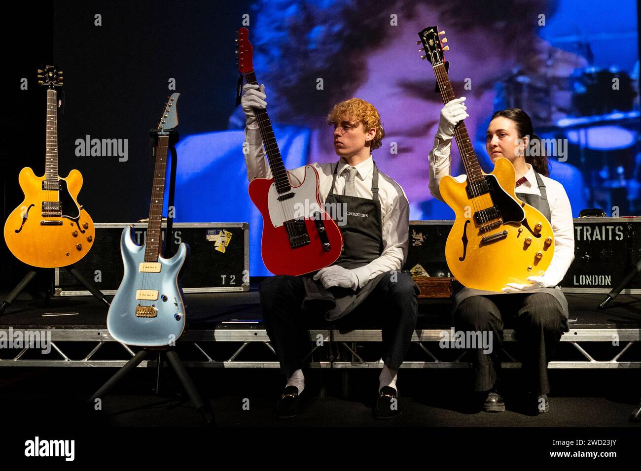 Christie's art handlers hold up Mark Knopfler's Red Schecter Telecaster ...