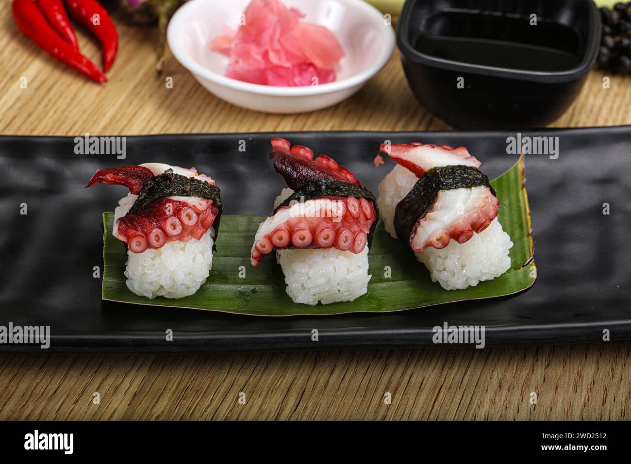 Japanese cuisine - sushi with octopus served ginger Stock Photo - Alamy