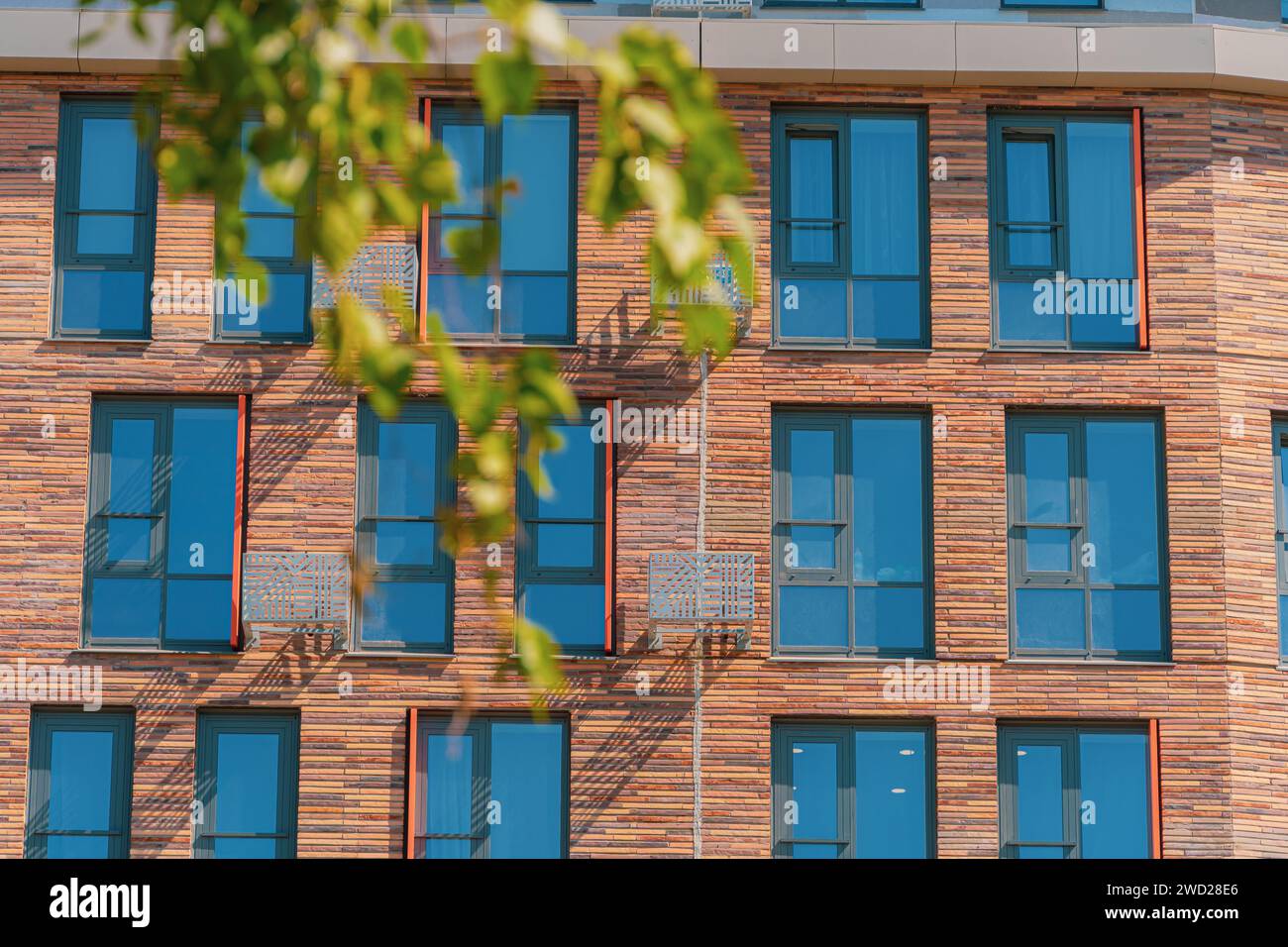 New building facade in housing complex. Modern style in architecture ...