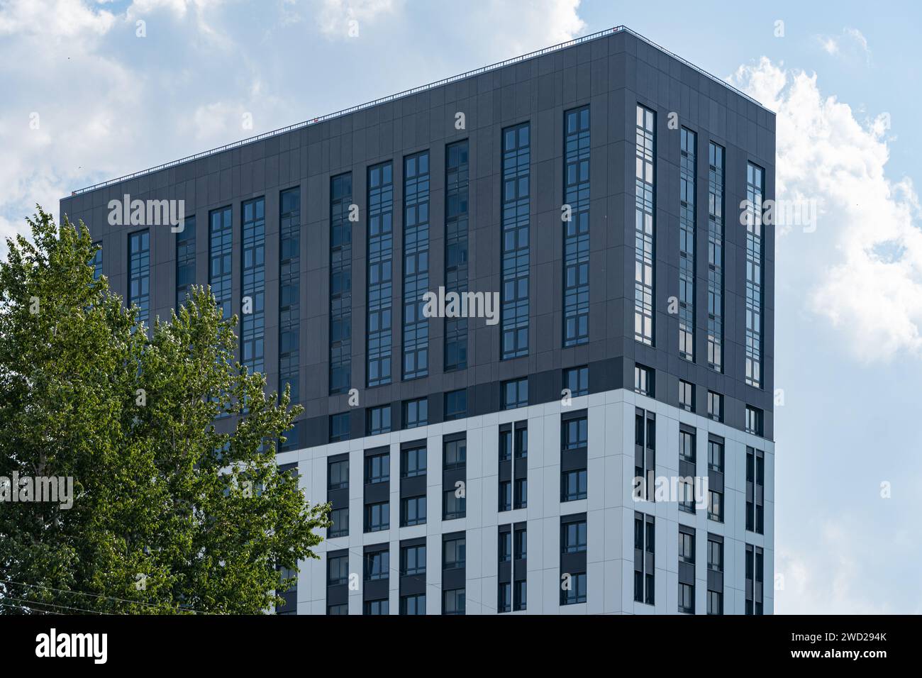 New building facade in housing complex. Modern style in architecture ...
