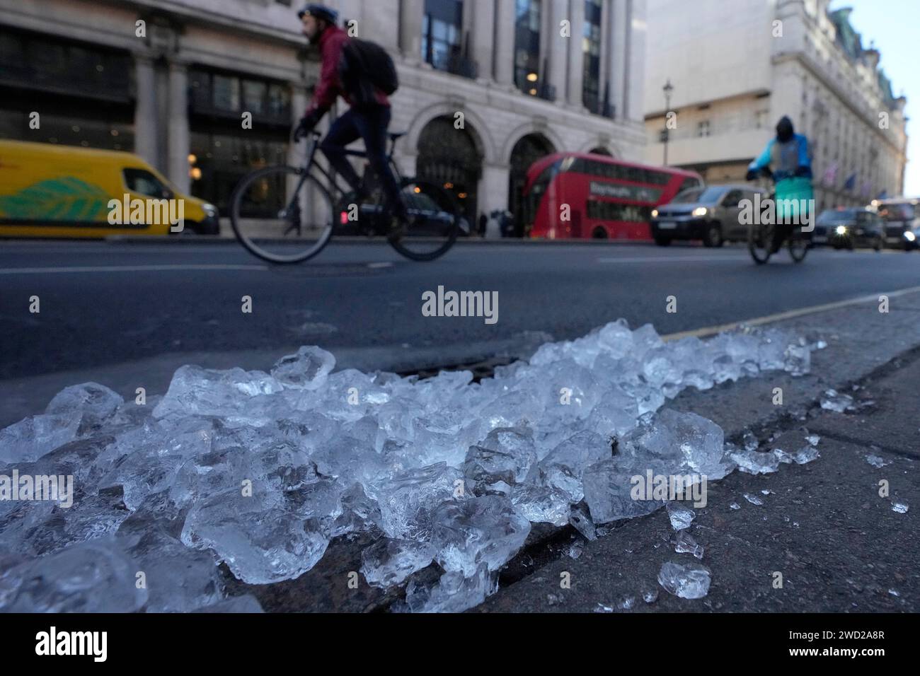 Ice cubes sit on a pavement in central London, Thursday, Jan. 18, 2024 ...