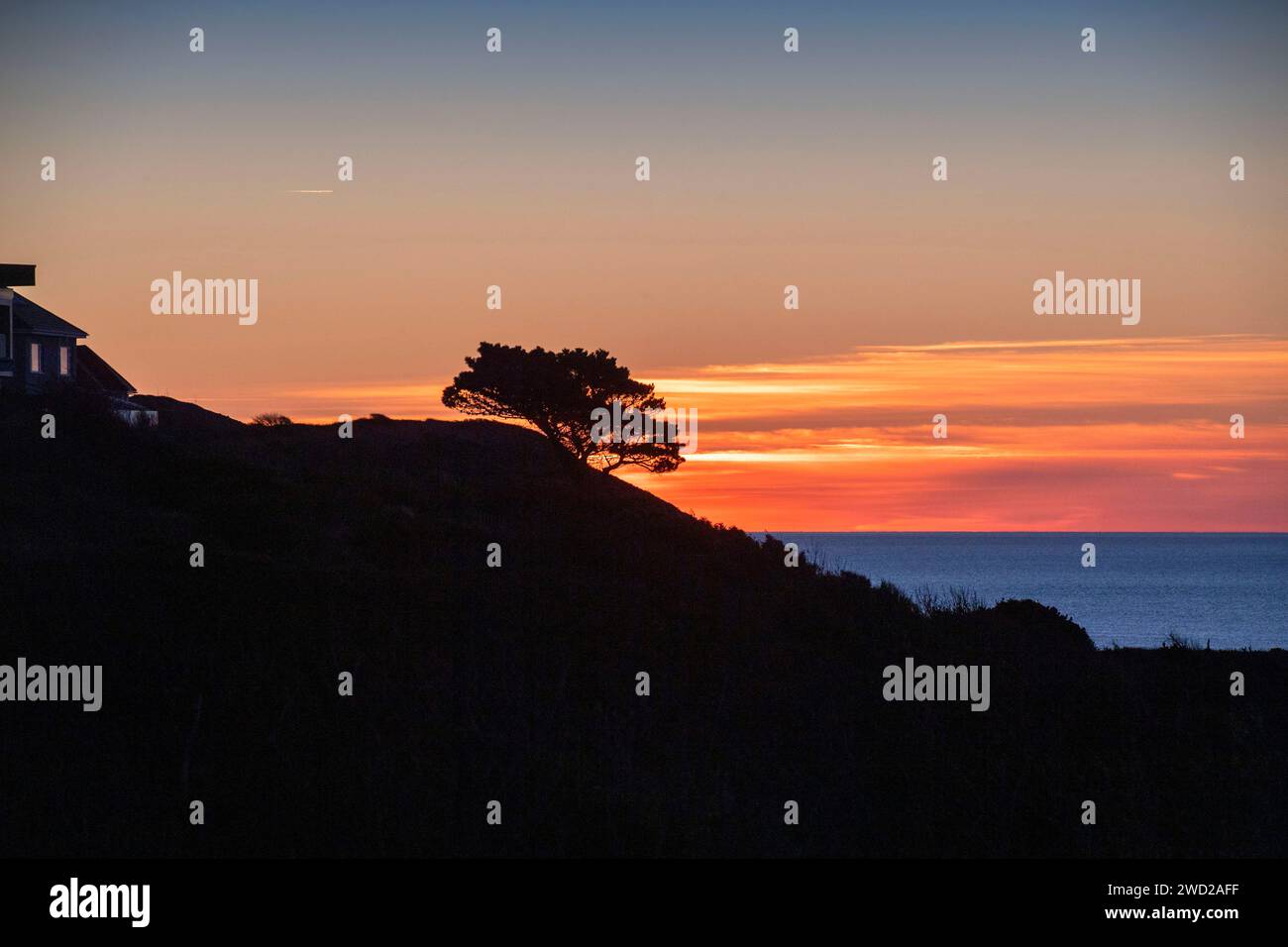 Swansea, UK. 18th Jan, 2024. A colourful sunrise at Langland Bay on the ...