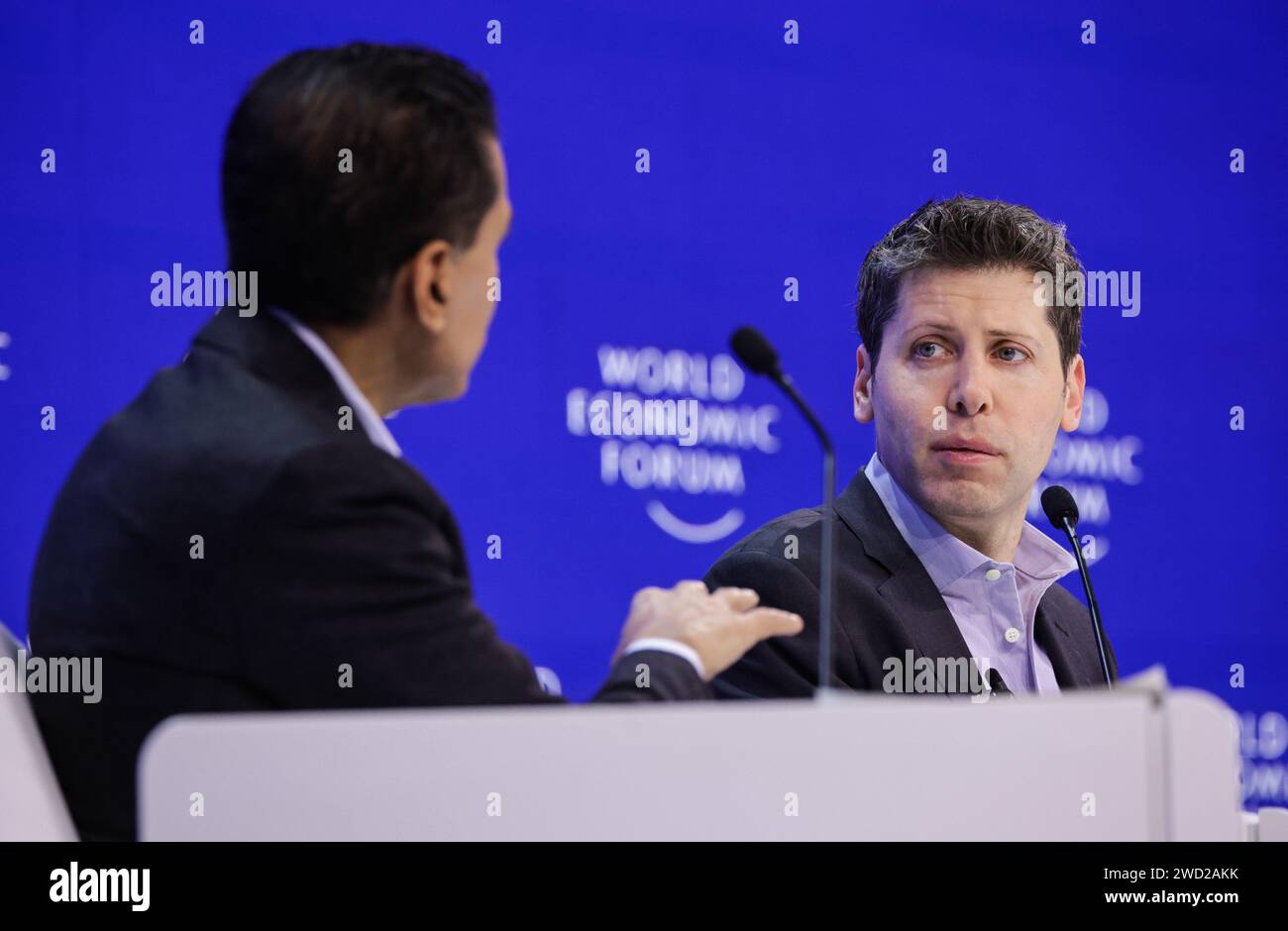 Davos, Switzerland. 18th Jan, 2024. Sam Altman (r), CEO OpenAI, takes ...