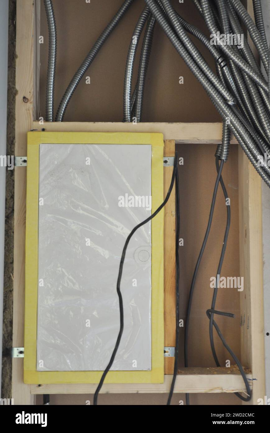 Electric Box installation in frame house wall with metal wire coverings ...