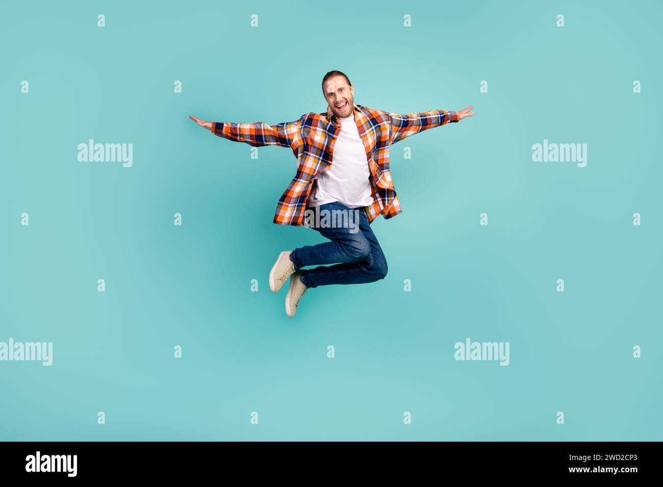Full length photo of overjoyed man wear flannel shirt denim trousers ...